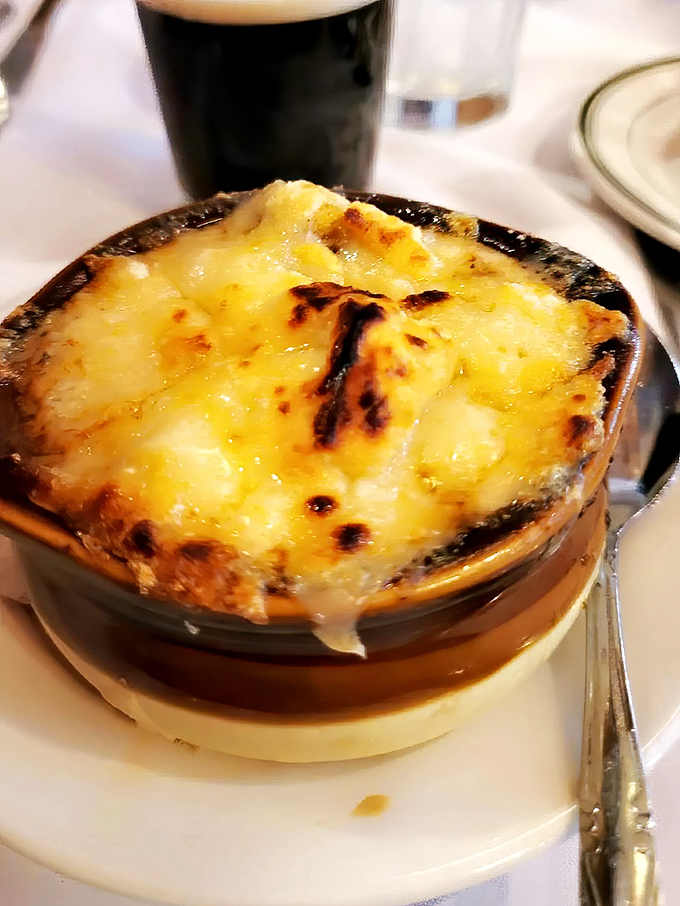 French onion soup with a crown of bubbling cheese that stretches dramatically with each spoonful&mdash;comfort food elevated to an art form.