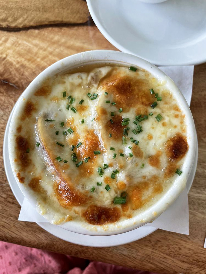 The star of the show &ndash; French onion soup with a bronzed cheese cap that stretches skyward like it's auditioning for a food commercial.