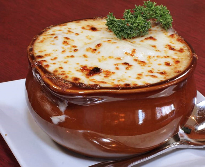 French onion soup with a cheese cap so perfect it could win medals in the Comfort Food Olympics.