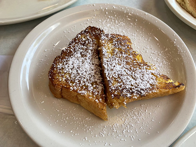 This French toast has clearly been dipped in something magical before hitting the griddle&mdash;then dusted with powdered sugar like fresh snow on Christmas morning.