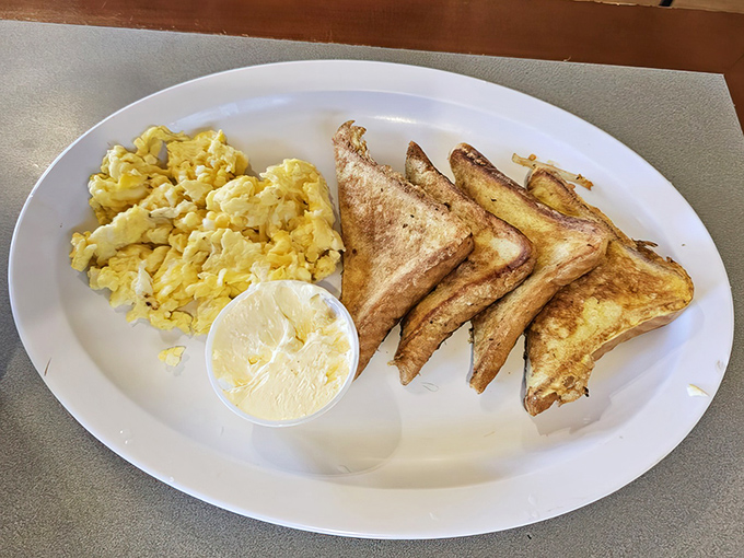 Simple pleasures done right: fluffy scrambled eggs and perfectly golden toast. Sometimes the classics don't need reinvention, just respect and proper execution.