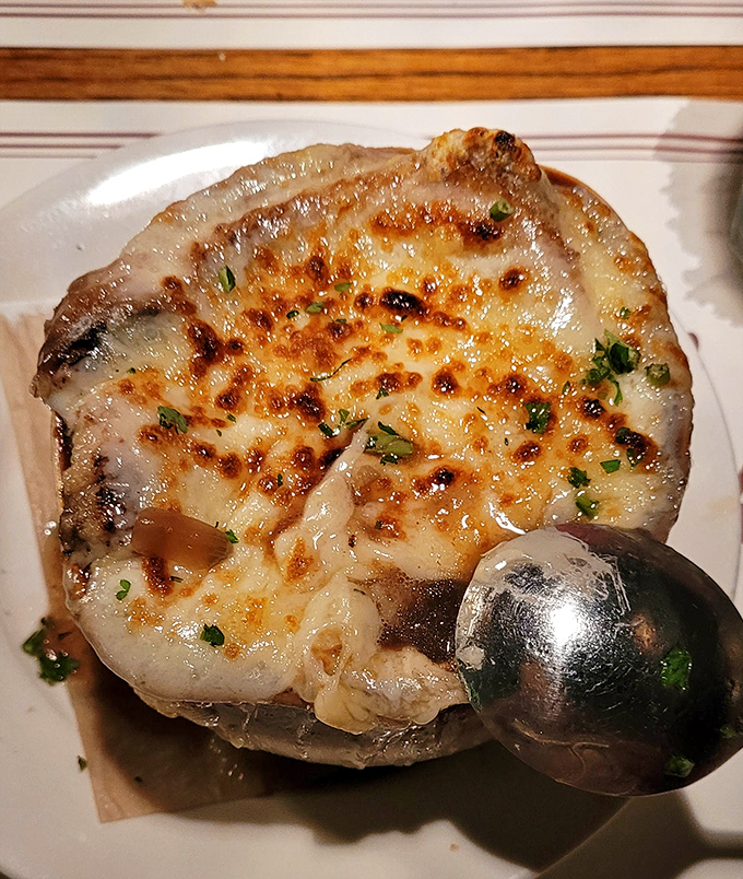 That's not just a stuffed mushroom—it's a flavor spaceship that's been to the moon and back. The broiled cheese crust deserves its own fan club.