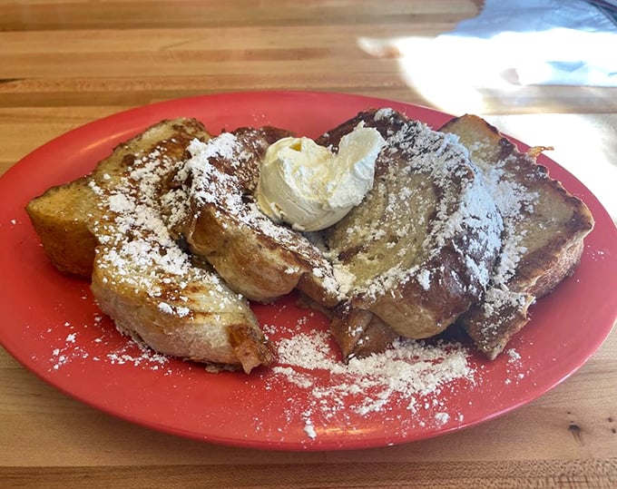 French toast that's been dipped, griddled, and powdered to perfection—with a scoop of butter slowly melting into every nook and cranny.