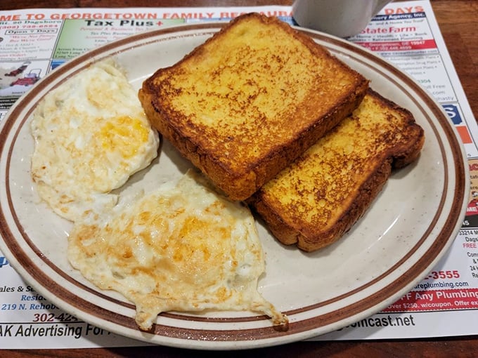 Toast so perfectly golden it belongs in Fort Knox, paired with eggs that define what "sunny-side up" should always aspire to be.