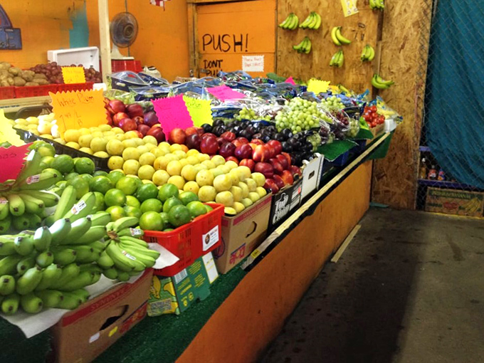 Farm-fresh produce adds vibrant color to the market experience. These fruits didn't travel further than your last vacation to reach these tables.