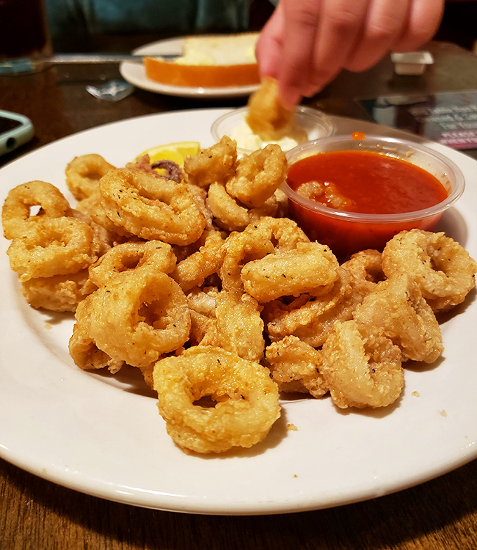 These golden rings of calamari aren't just appetizers &ndash; they're edible jewelry, each bite offering the perfect balance of tender squid and crispy coating.