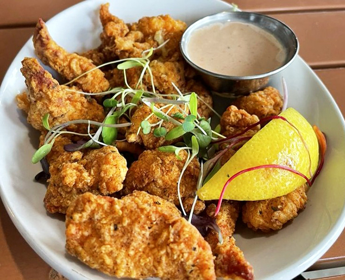 Fried Lobster Bites arrive golden and crispy, like little nuggets of ocean treasure. The dipping sauce isn't optional&mdash;it's the perfect dance partner for these crunchy delights.