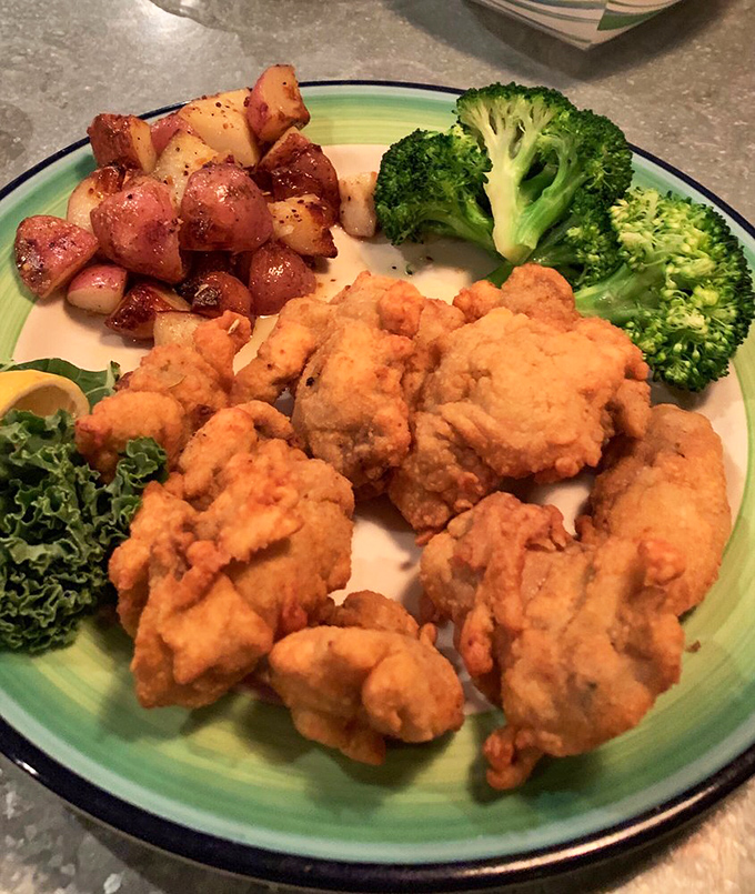Fried oysters so perfectly golden they deserve their own trophy, paired with simple sides that know their supporting role.