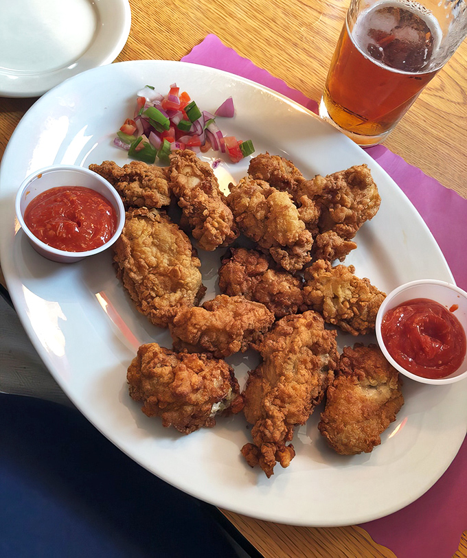 Fried oysters piled high like edible treasure, proving that sometimes the best things come in crunchy packages.