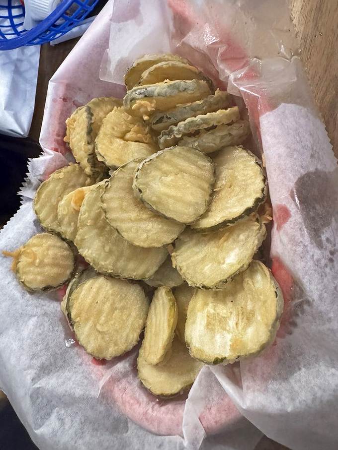 Fried pickles that achieve the impossible: maintaining their crunch while delivering that perfect tangy-salty punch with each bite.