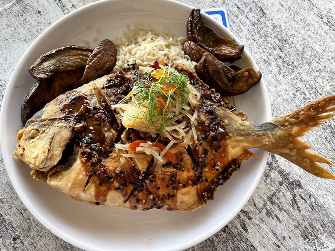 A whole fried pompano that stares back at you, challenging your dining etiquette while rewarding your taste buds with sweet, delicate flesh.