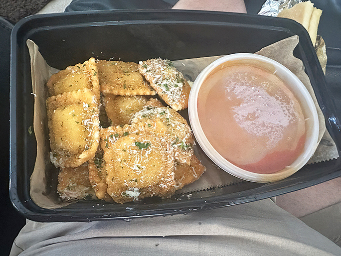 Crispy fried ravioli pillows arrive golden and ready for dipping, proving appetizers can be just as memorable as entrees.