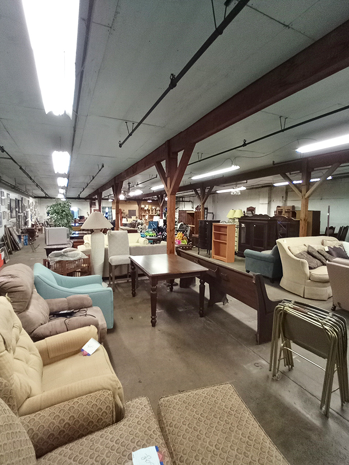 A showroom where furniture from different eras mingles like guests at an eclectic dinner party. Those wooden supports have witnessed countless transformations.