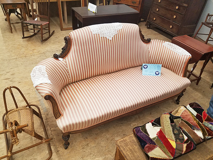 That striped settee has witnessed decades of conversations. Now it waits patiently for its next chapter in someone's carefully curated living room.