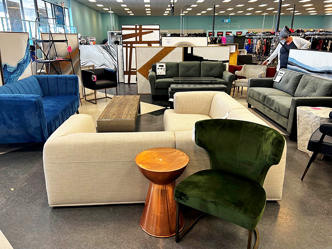Mid-century meets modern in this furniture vignette – that emerald velvet chair is practically begging to become the star of your living room.
