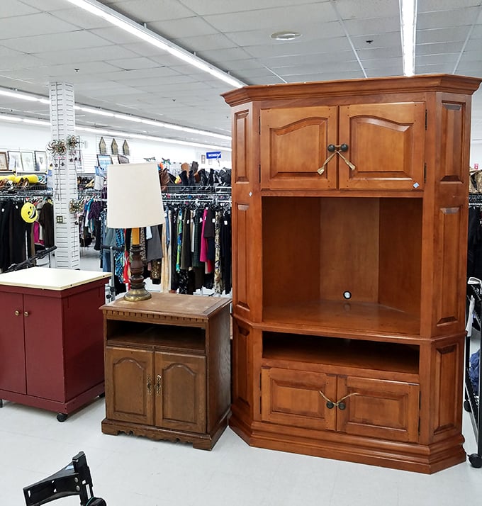 Solid wood entertainment centers stand like sentinels of a bygone era, when TVs were deeper than they were wide and required their own furniture kingdoms.