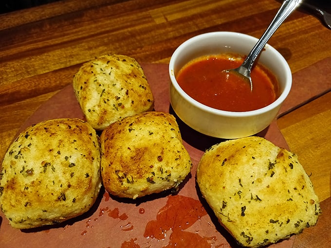 These herb-flecked garlic rolls aren't just bread&mdash;they're vehicles designed specifically for sauce transportation. Engineering at its most delicious.