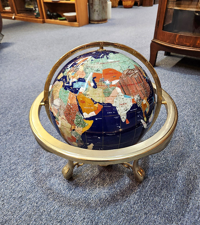 The world at your fingertips! This gemstone globe isn't just geography&mdash;it's jewelry for your library shelf. 