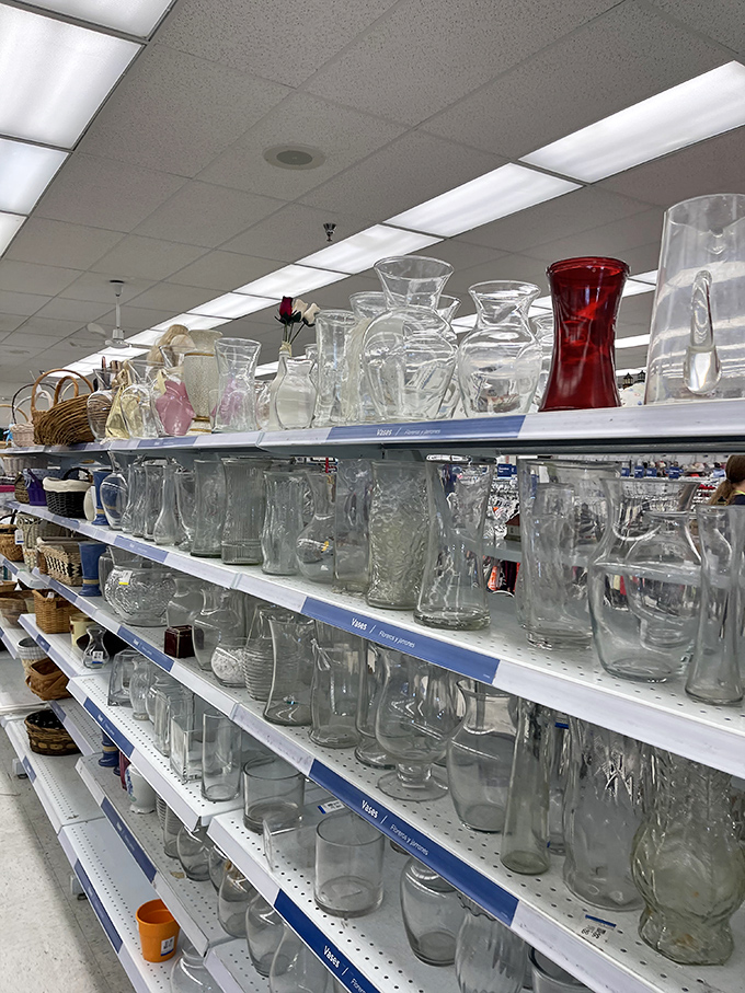 The glassware aisle shimmers under fluorescent lights &ndash; that single ruby vase standing out like a celebrity at a high school reunion.