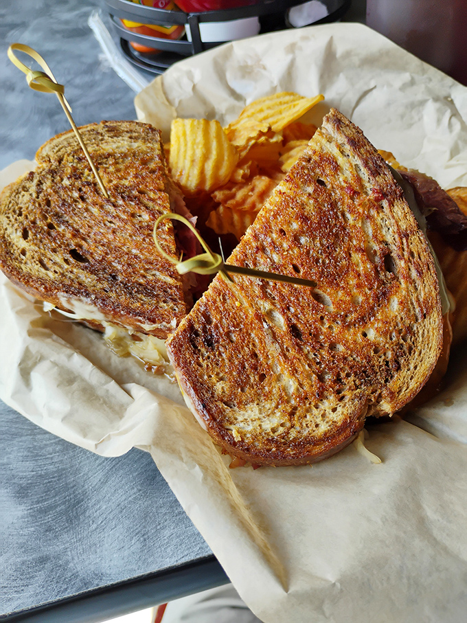 The humble grilled cheese, elevated to art form &ndash; perfectly browned bread revealing a molten interior that stretches with each bite.