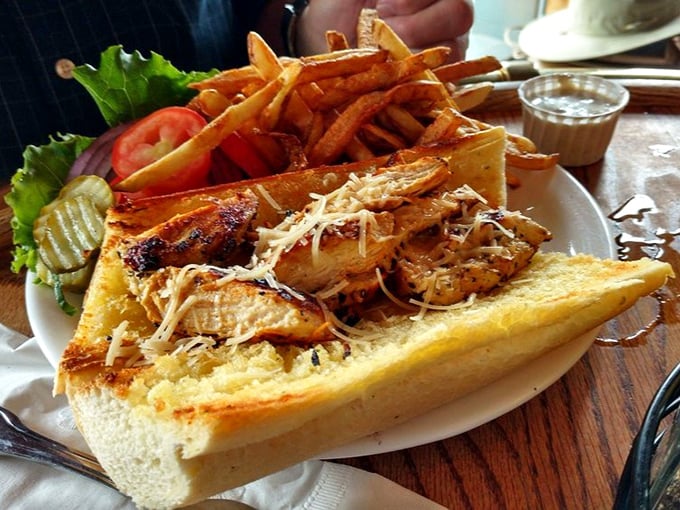 This isn't just a sandwich; it's architecture. Layers of grilled chicken, melted cheese, and fresh vegetables on perfectly toasted bread.