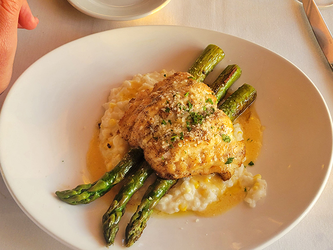 Grouper Vince gets the star treatment here&mdash;perfectly seared and set over creamy corn risotto, with asparagus standing at attention like the supporting cast it deserves.