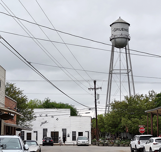 The iconic Gruene water tower stands sentinel, a weathered landmark that's seen more Texas history than a Ken Burns documentary.