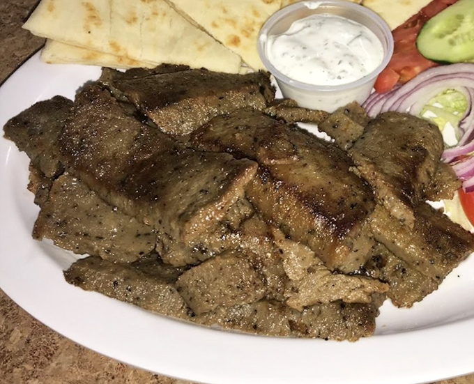 That gyro meat glistens like it knows something you don't &ndash; spoiler alert: it knows it's delicious.