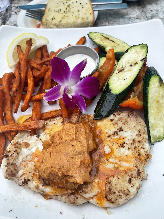 Simple perfection on a plate &ndash; grilled fish with sweet potato fries and veggies that taste like they were harvested minutes ago.