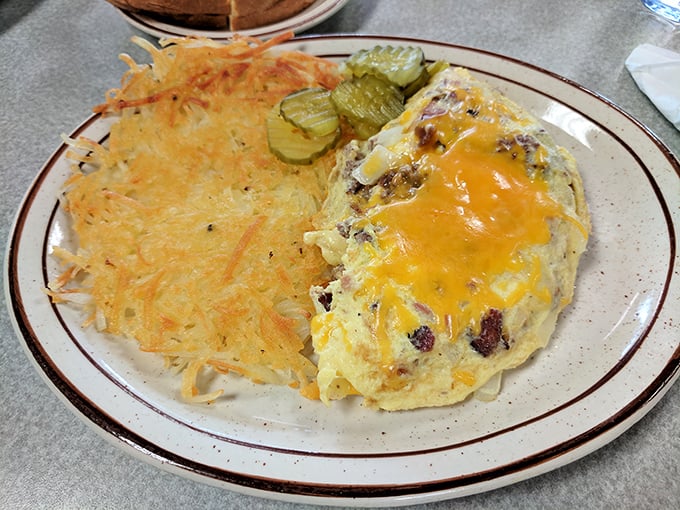 A breakfast trinity: golden hash browns with edges crispy enough to make a satisfying crunch, eggs, and a breakfast burrito that means business. 