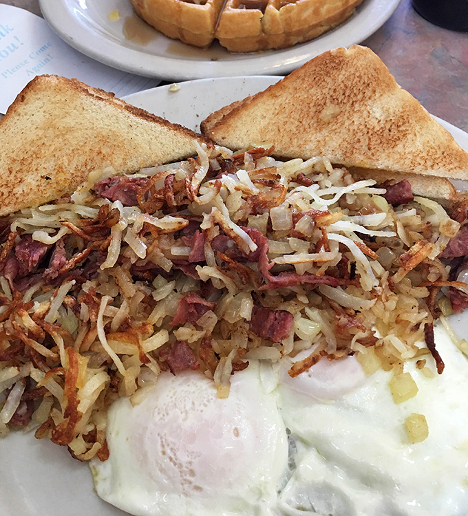 A breakfast symphony &ndash; crispy hashbrowns, perfectly cooked eggs, and toast standing by for yolk-sopping duty. Morning music to your stomach.