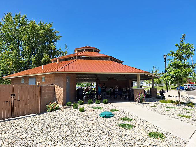 Heritage Park's pavilion stands ready for community gatherings, where potluck dishes and neighborhood news are shared with equal enthusiasm.