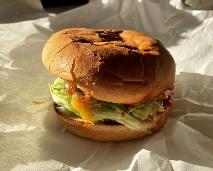 The Hickoryburger wrapped in paper like a delicious present—no ribbons needed when flavor does all the talking.