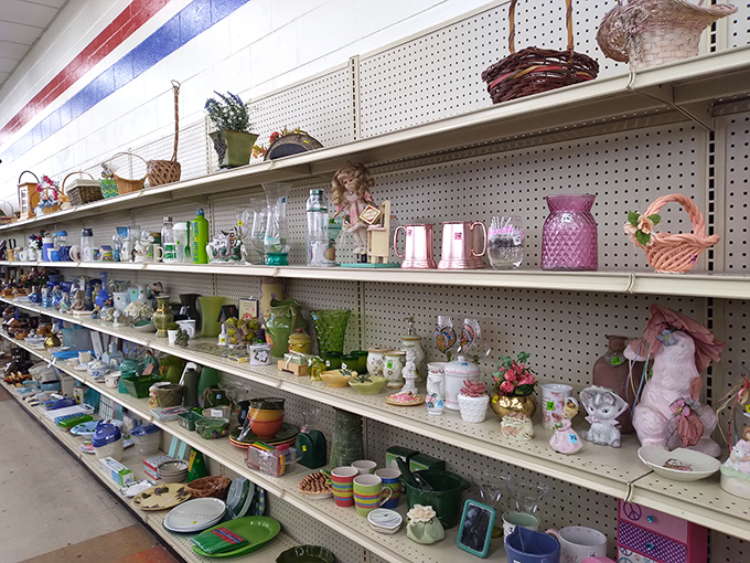 Pink pitchers and vintage treasures line these shelves like a grandmother's china cabinet had a yard sale baby.