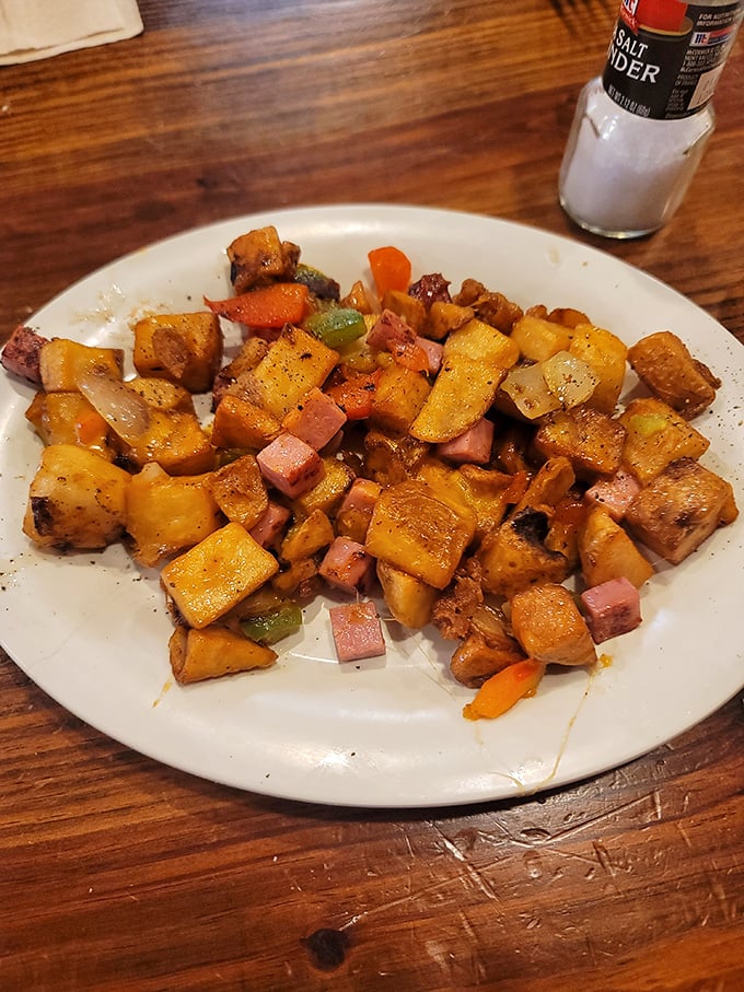 Home fries that didn't just phone it in. These colorful cubes of potato perfection mingle with peppers and ham like old friends at a reunion.