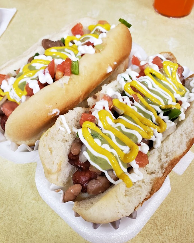 Hot dogs elevated to an art form&mdash;dressed with zigzags of mustard and mayo, topped with fresh veggies, and served on pillowy buns that deserve their own fan club.
