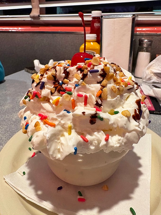 This sundae doesn't just have whipped cream&mdash;it has a whipped cream penthouse with sprinkle neighbors and a cherry landlord.