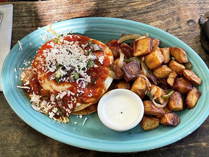 Huevos Rancheros that would make your abuela proud&mdash;crispy tortillas, vibrant sauce, and cheese that doesn't just melt, it surrenders.