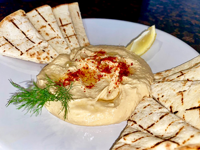 Hummus so creamy it could make velvet jealous, sprinkled with paprika and served with warm flatbread for the perfect scoop-to-mouth ratio.