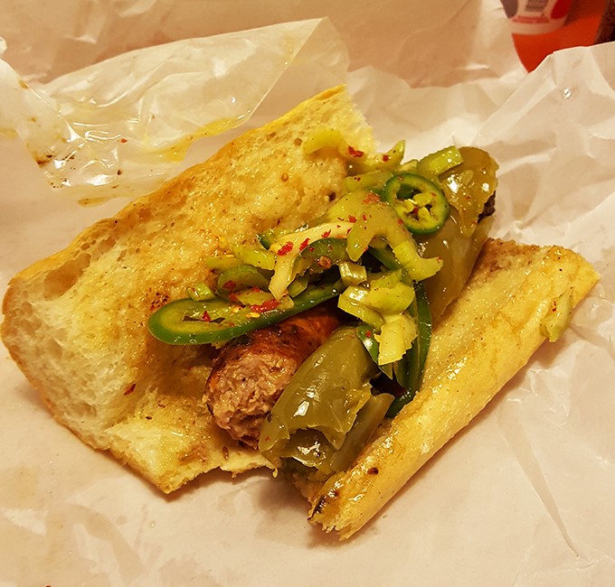 The Italian sausage nestled in fresh bread with peppers is Chicago comfort food at its finest&mdash;a portable feast that demands to be savored.