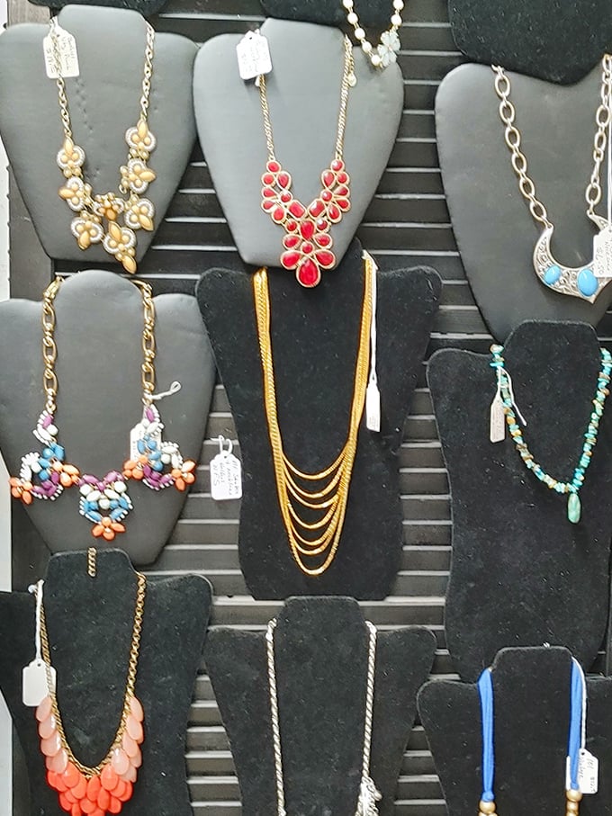 A jewelry display that makes your neck feel naked just looking at it. That red statement necklace is practically shouting "Buy me!"