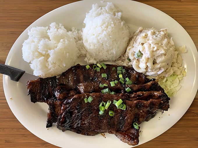 Two scoops rice, mac salad, and kalbi ribs with that perfect char &ndash; the holy trinity of Hawaiian plate lunch elevated to art form.