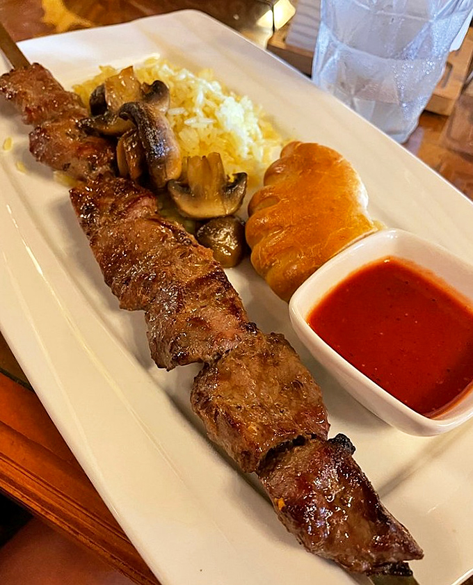 This lamb kebab isn't just cooked, it's been wooed by flame until it surrendered all its flavor, accompanied by rice that's absorbed all the right secrets.