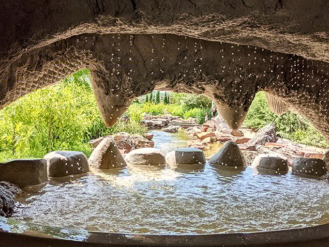 Peering through this stone archway feels like discovering a secret portal to another world, complete with its own babbling soundtrack.
