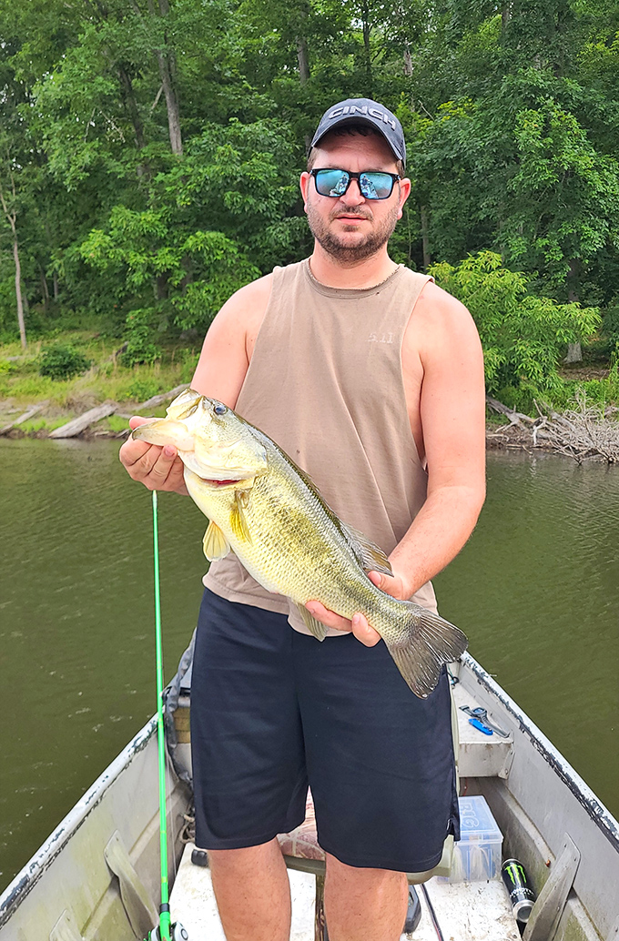 The smile says it all. Lake Hope's bass fishing creates the kind of memories that grow slightly larger with each retelling.