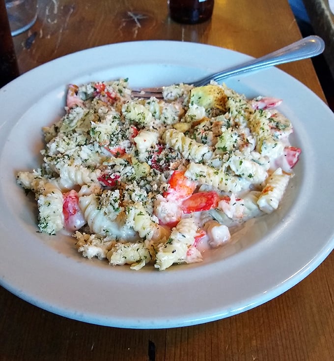 Lobster mac and cheese that makes you question why anyone bothers with the regular kind. Comfort food that's had a luxurious Maine makeover.