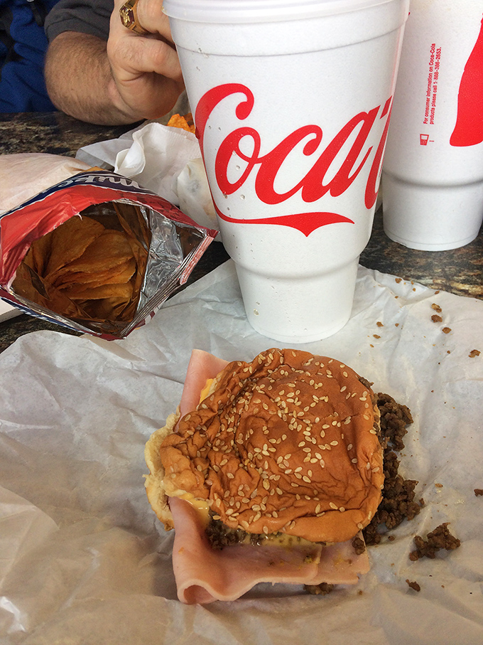 A sesame-topped bun cradles the famous loose meat&mdash;half sandwich, half delicious puzzle that requires strategic eating techniques.