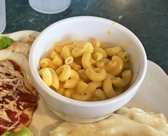 Mac and cheese that doesn't hide behind fancy additions &ndash; just perfectly cooked pasta embraced by creamy, golden cheese that speaks for itself.