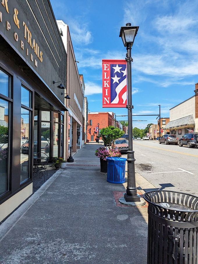 Elkin pride flies high along Main Street. The town banners and carefully maintained storefronts speak volumes about community spirit.