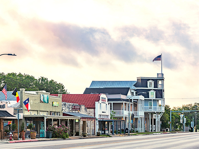 Another angle of Fredericksburg's enchanting Main Street, where Texas flags wave proudly alongside storefronts that have witnessed generations of Hill Country history.